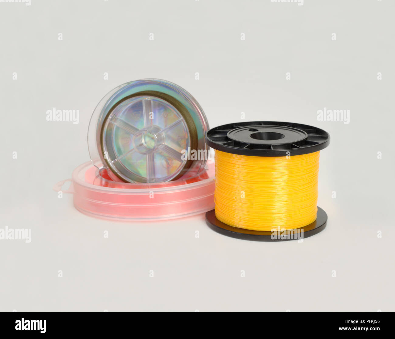Three different types of fishing lines on reels Stock Photo - Alamy