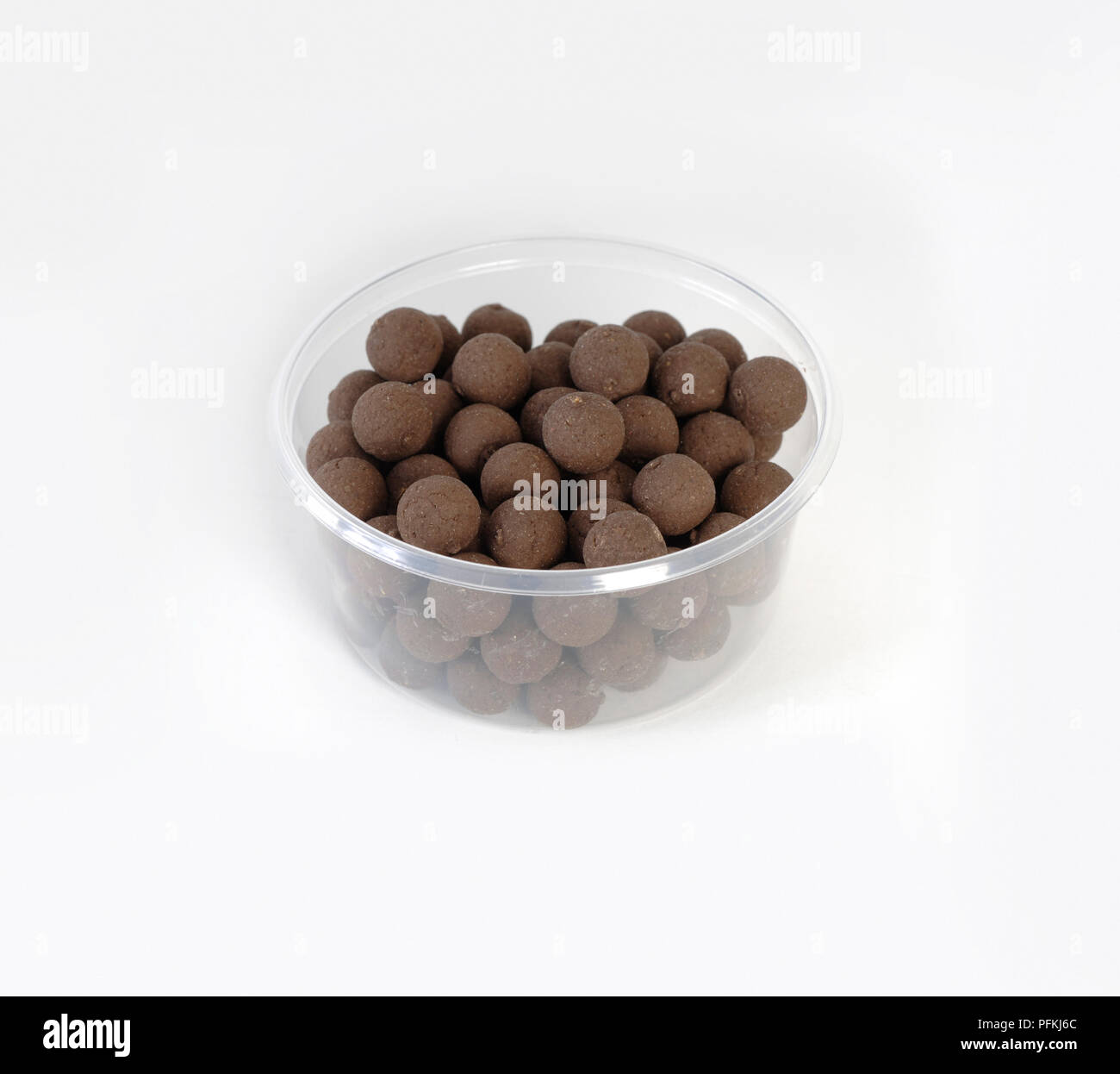 Boilies in plastic container Stock Photo - Alamy