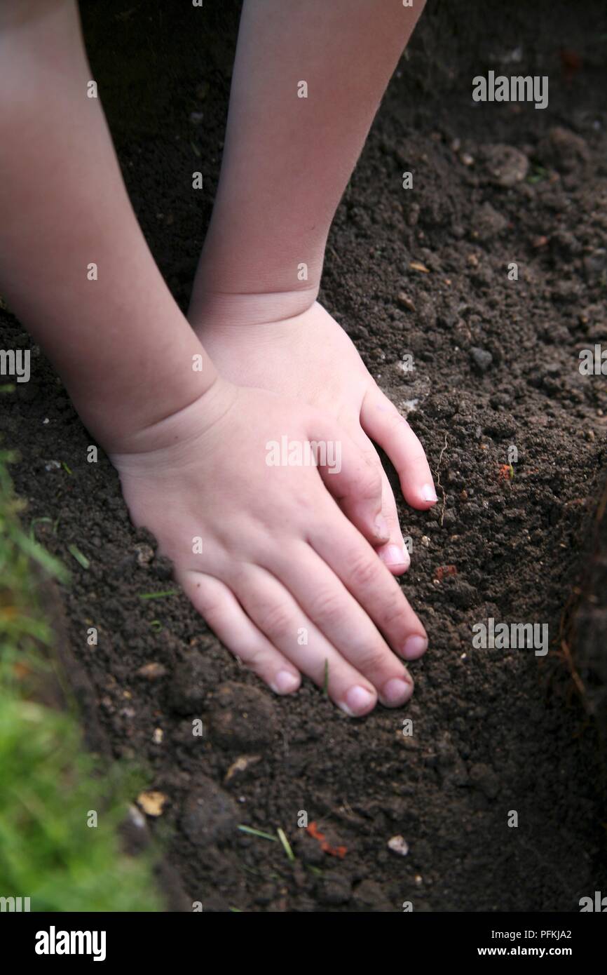 Patting down soil hi-res stock photography and images - Alamy