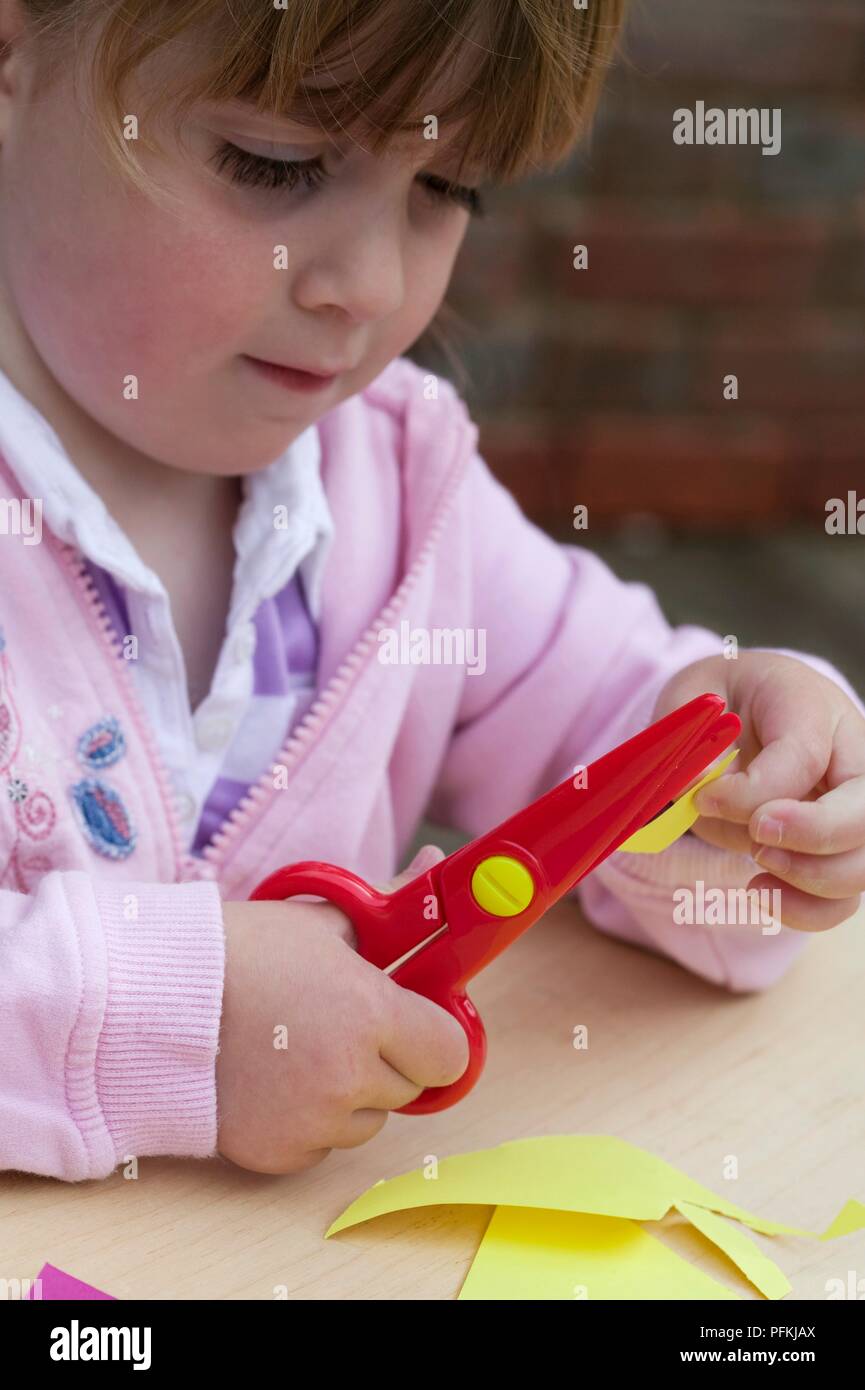 Close up girls hand cutting hi-res stock photography and images - Alamy