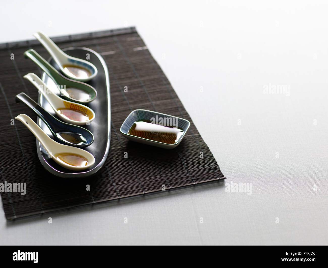 Spoons containing various types of Vietnamese and Thai fish sauce, on ...