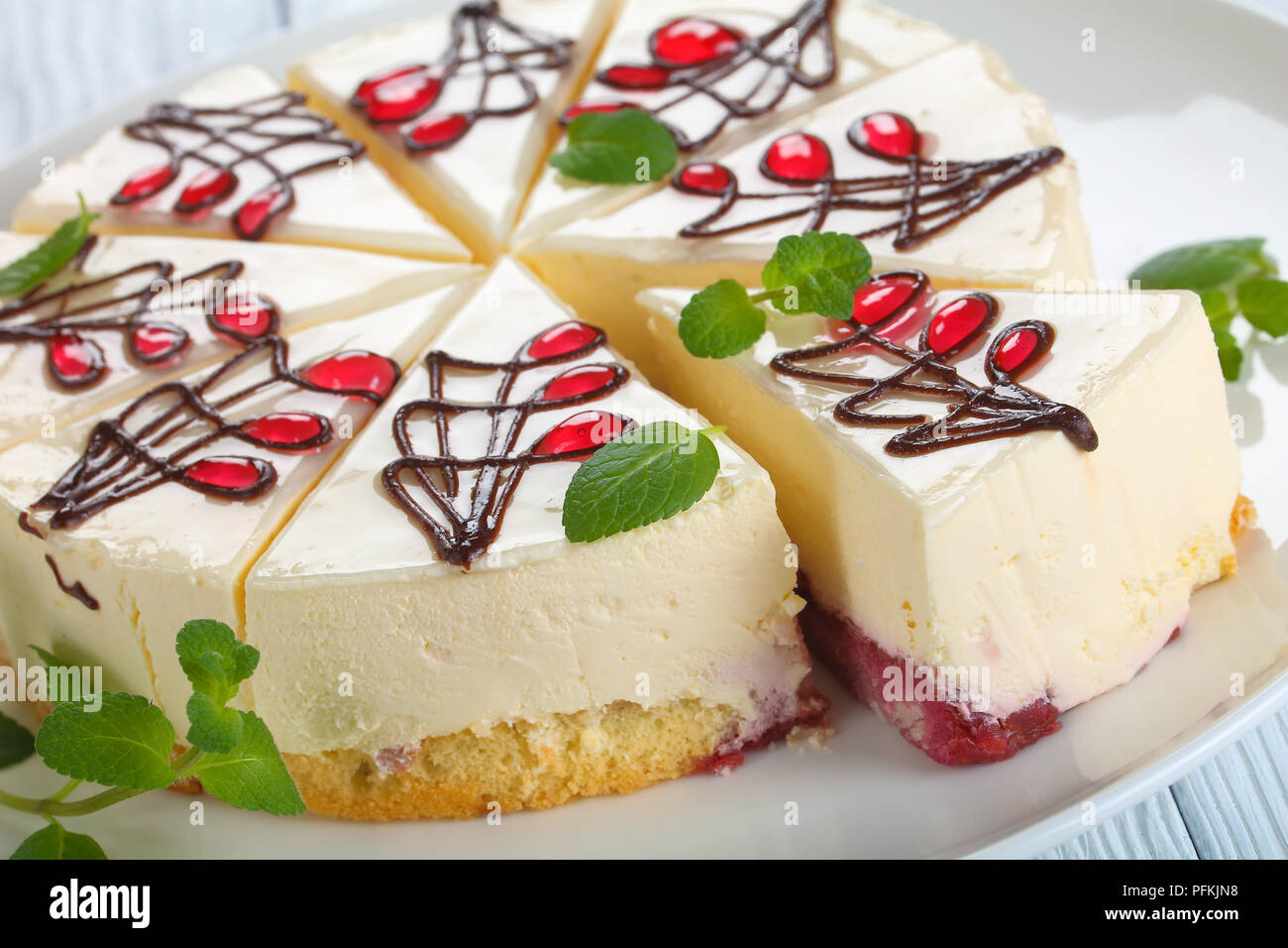 close-up of cheesecake with bottom layer consists of sponge cake with ...
