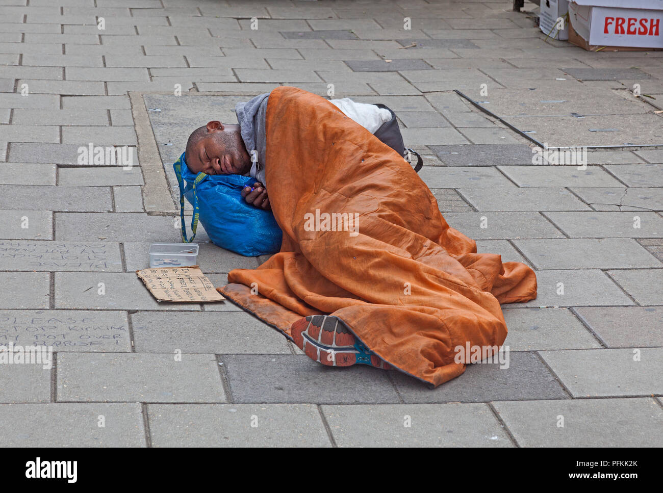City of London A rough sleeper asleep on the pavement mid-morning in ...