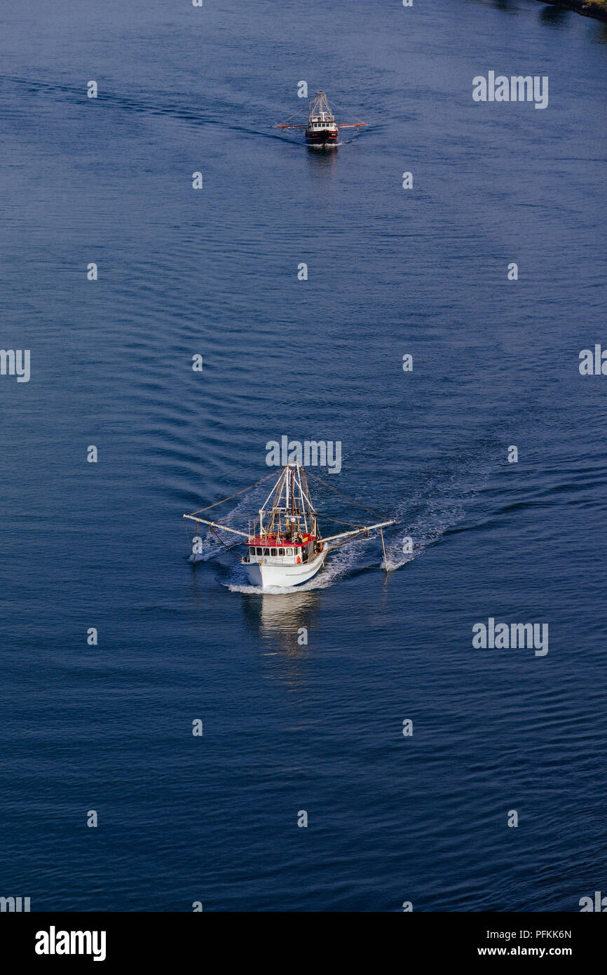 Commercial fishing trawler heading out to sea in from the tweed River ...