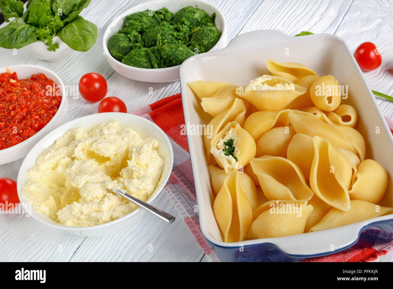 big pasta shells in the making to be stuffed with cheese and spinach ...