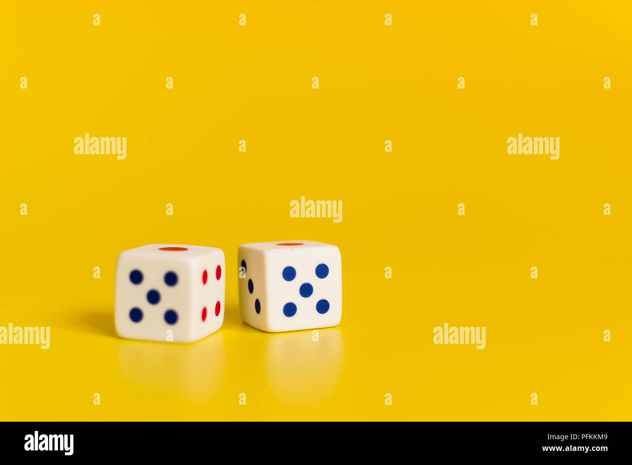 white dice on a yellow background different values of numbers Stock ...