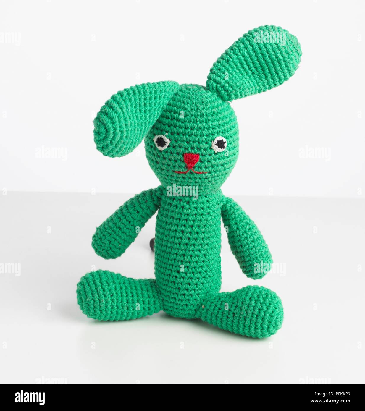 Green, crocheted toy rabbit Stock Photo - Alamy