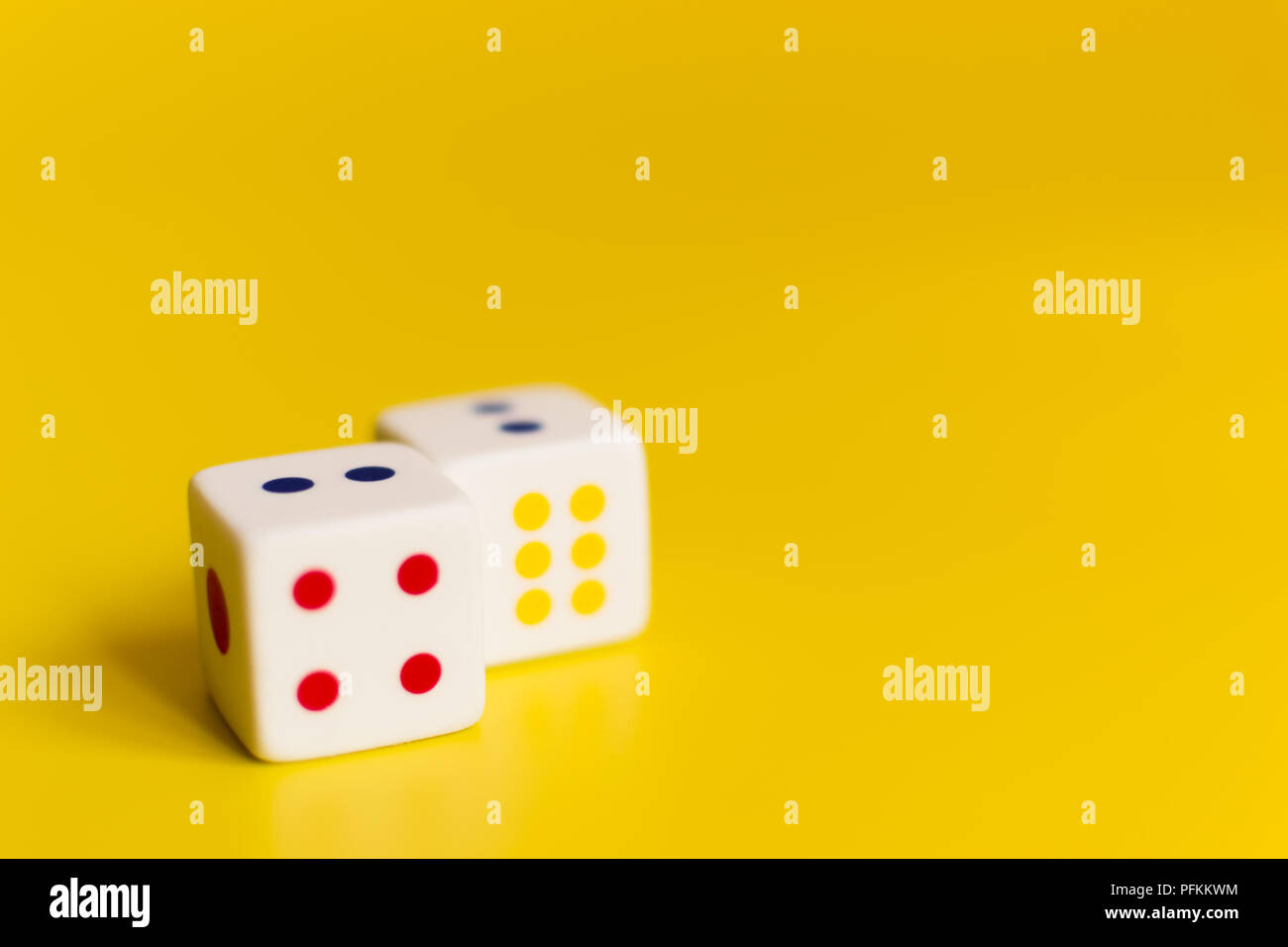 white dice on a yellow background different values of numbers Stock ...