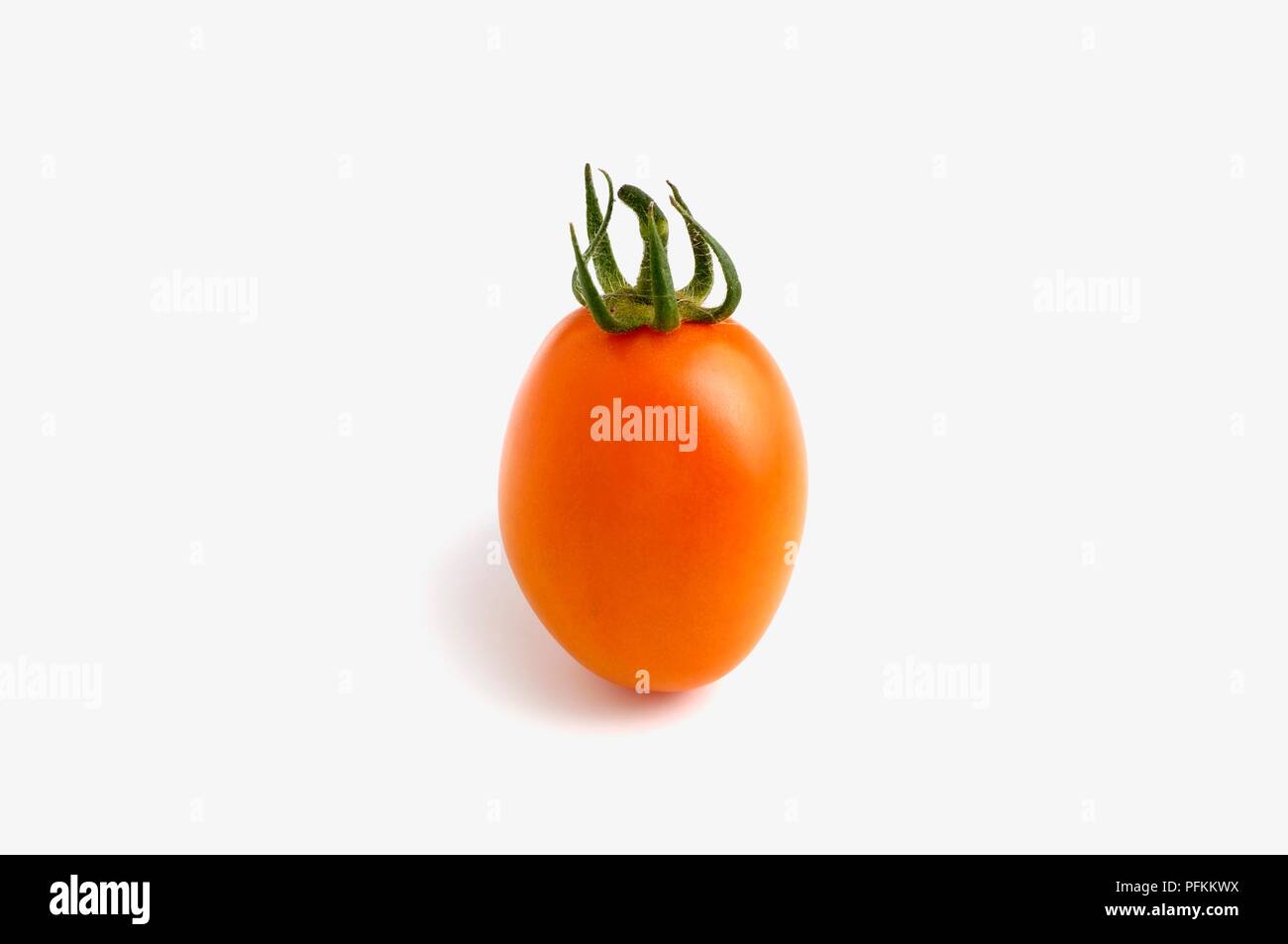 Whole English Aviro tomato, formerly known as Orange Plum Stock Photo ...
