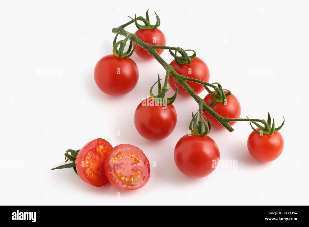 Whole and sliced Dutch red Nectar tomatoes Stock Photo - Alamy
