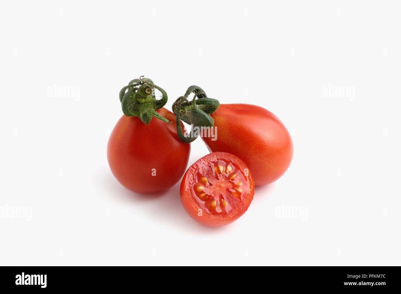 Whole and sliced American Red Fig tomatoes Stock Photo - Alamy