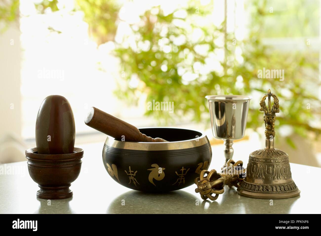 Shiva lingam, an egg shaped stone, Vajra and bell, Tantra cup, and ...