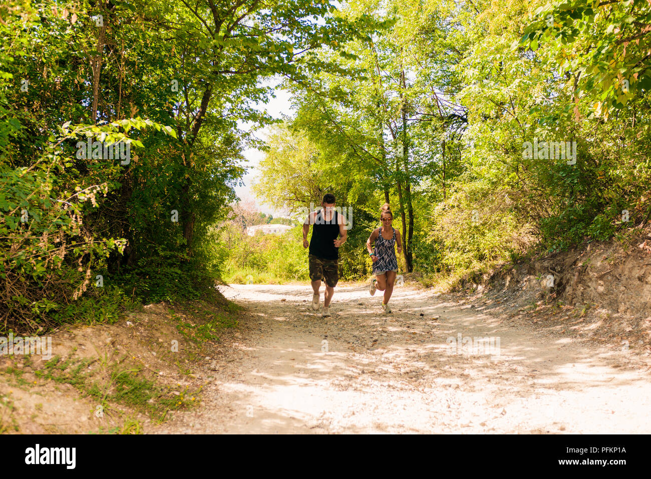 Couple attractive marathon runners jogging hi-res stock photography and ...