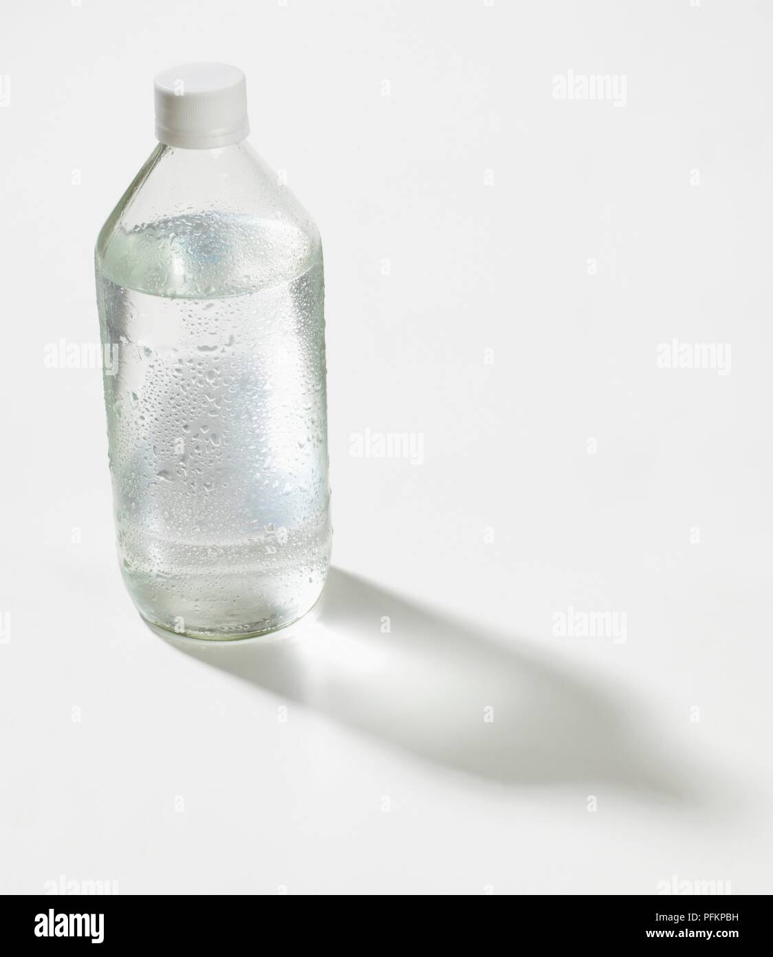 Condensation on glass bottle of cold water Stock Photo - Alamy