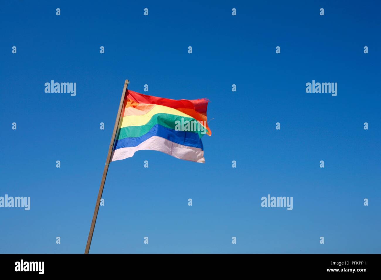Rainbow flag against the sky hi-res stock photography and images - Alamy