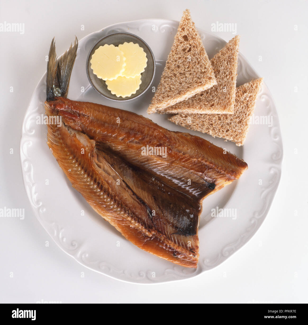 Smoked kippers, served with bread and butter, view from above Stock ...