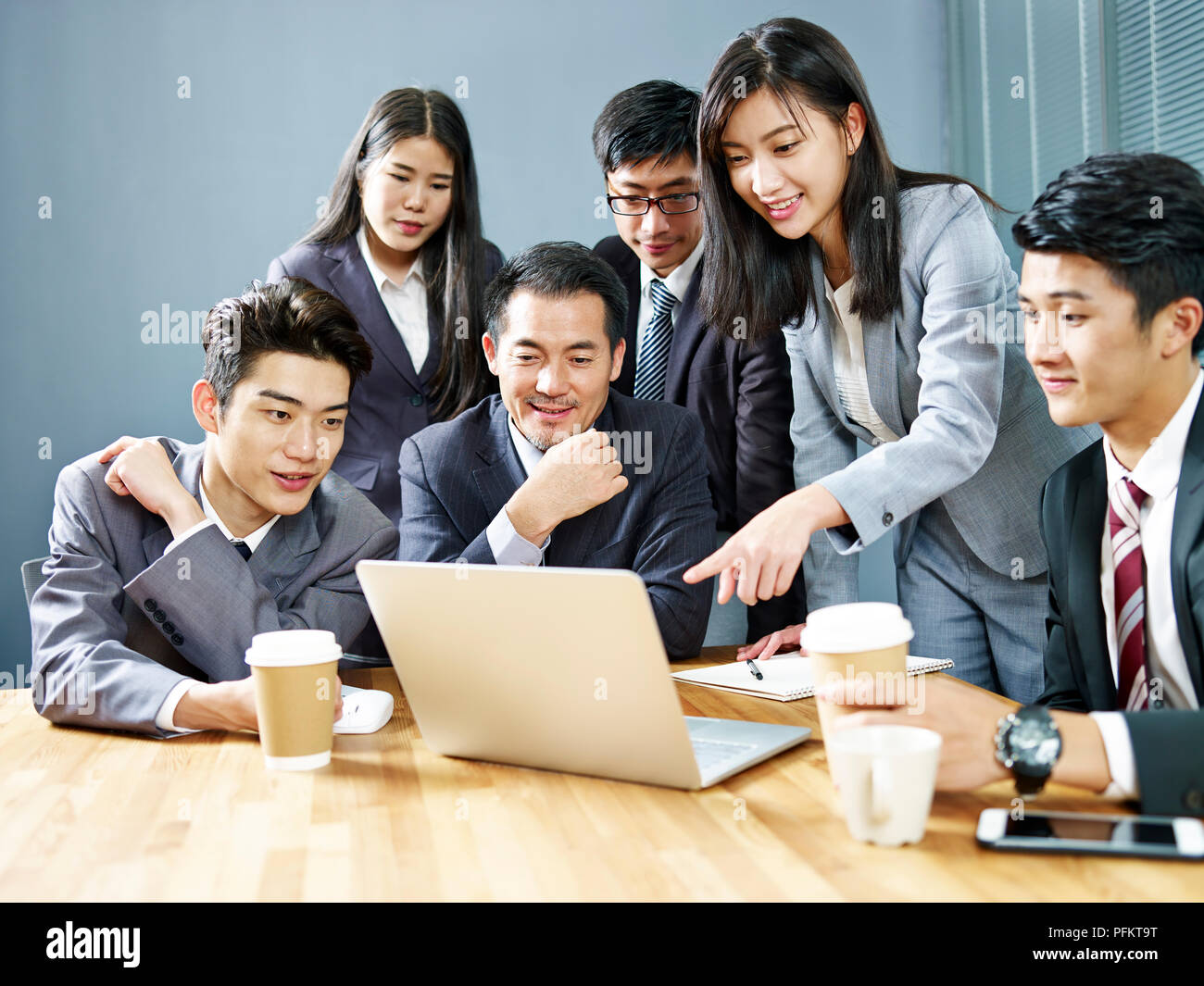Reviewing team pointing laptop hi-res stock photography and images - Alamy