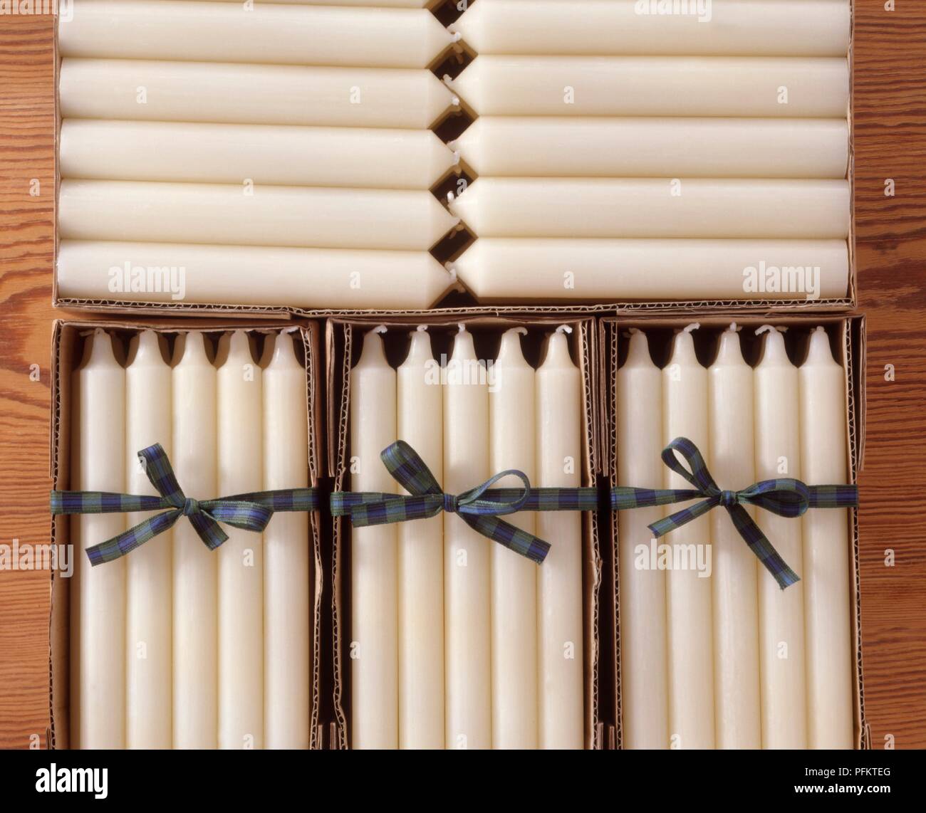 Candles tied with ribbons and loose candles in boxes Stock Photo - Alamy