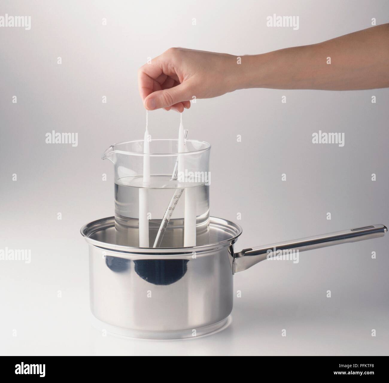 Hand dipping candles hi-res stock photography and images - Alamy