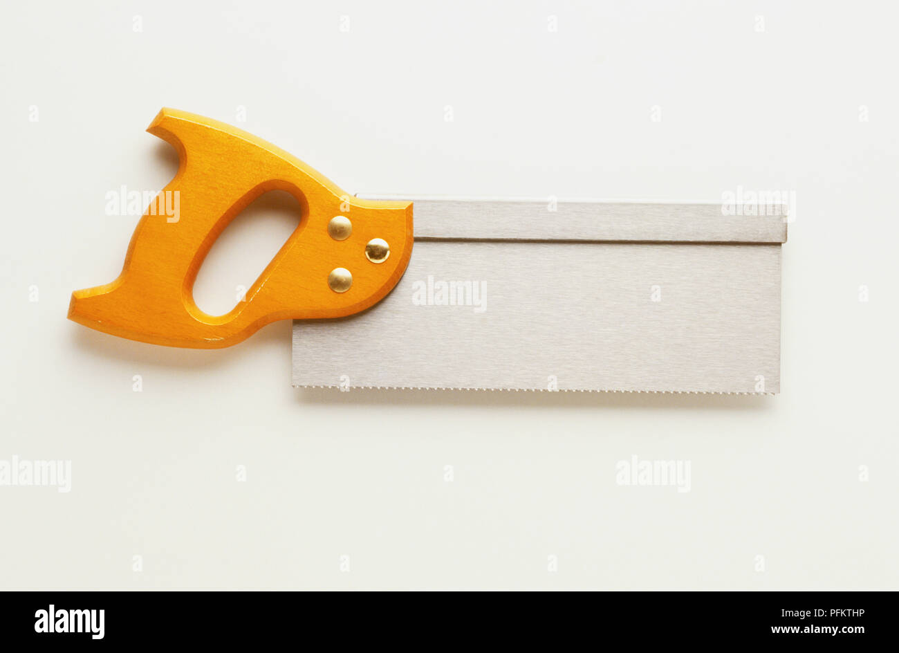 A short saw with a yellow handle Stock Photo - Alamy