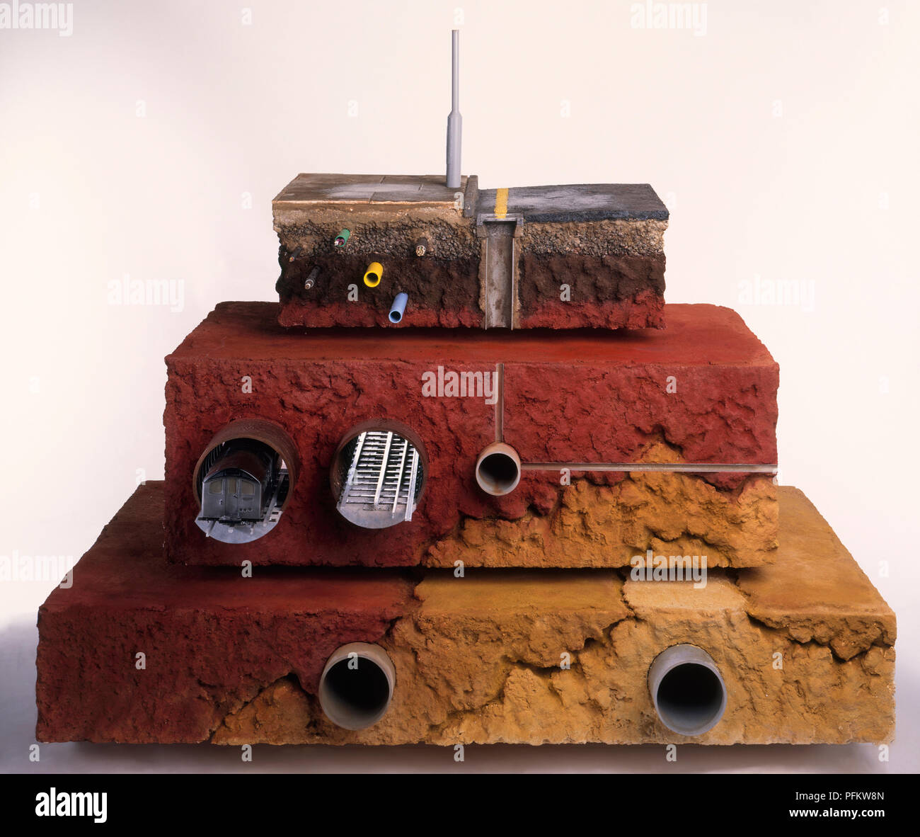 Cross-section model of life beneath a city street showing underground ...