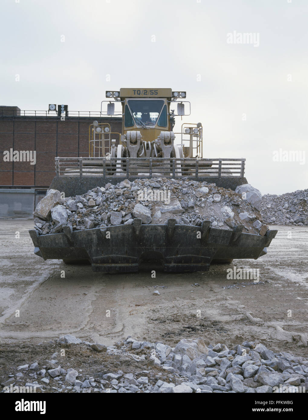 Bulldozer carrying rubble Stock Photo - Alamy