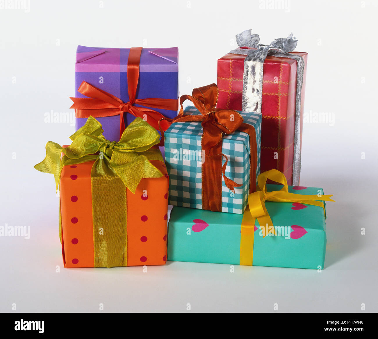 Five colourfully wrapped gift boxes, front view Stock Photo - Alamy