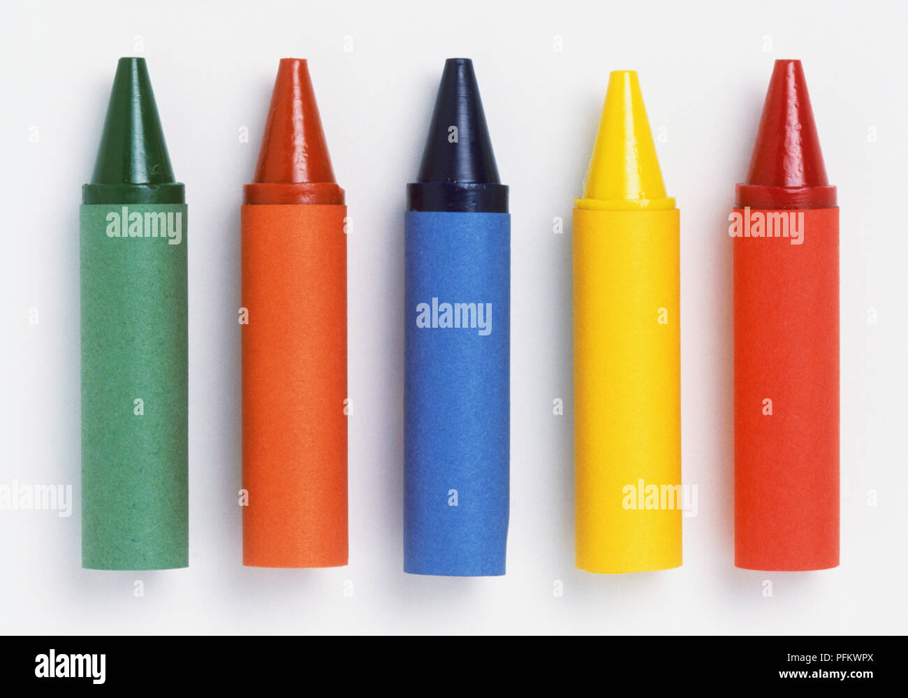 Five coloured crayons, red, yellow, blue, orange and green Stock Photo ...