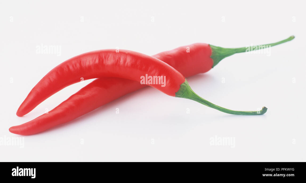 Two fresh red chilli peppers Stock Photo - Alamy