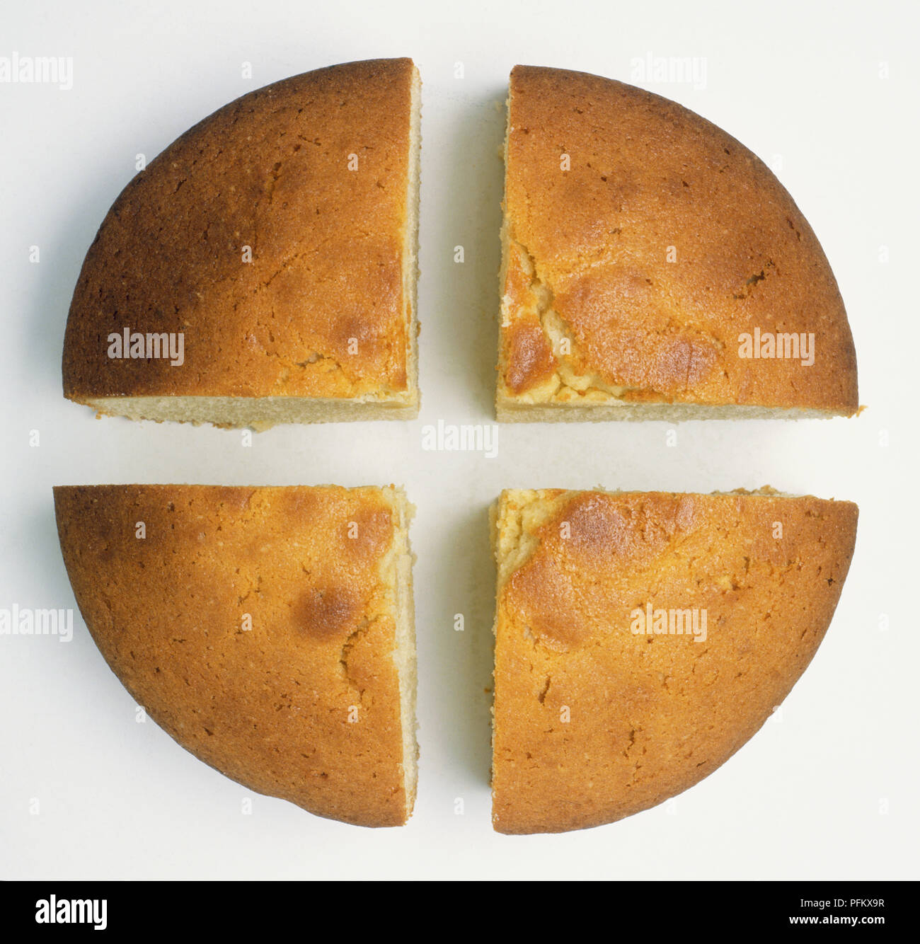 Cake divided into four pieces Stock Photo - Alamy