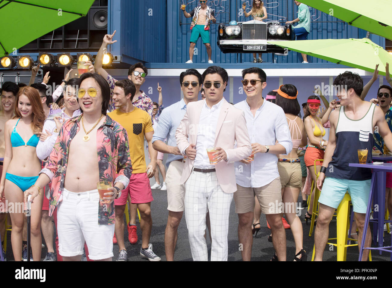 CRAZY RICH ASIANS, Ronny Chieng (left, pink shirt), Jimmy O. Yang (open ...