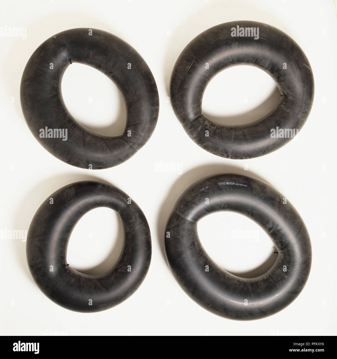 Four inflated rubber rings Stock Photo - Alamy