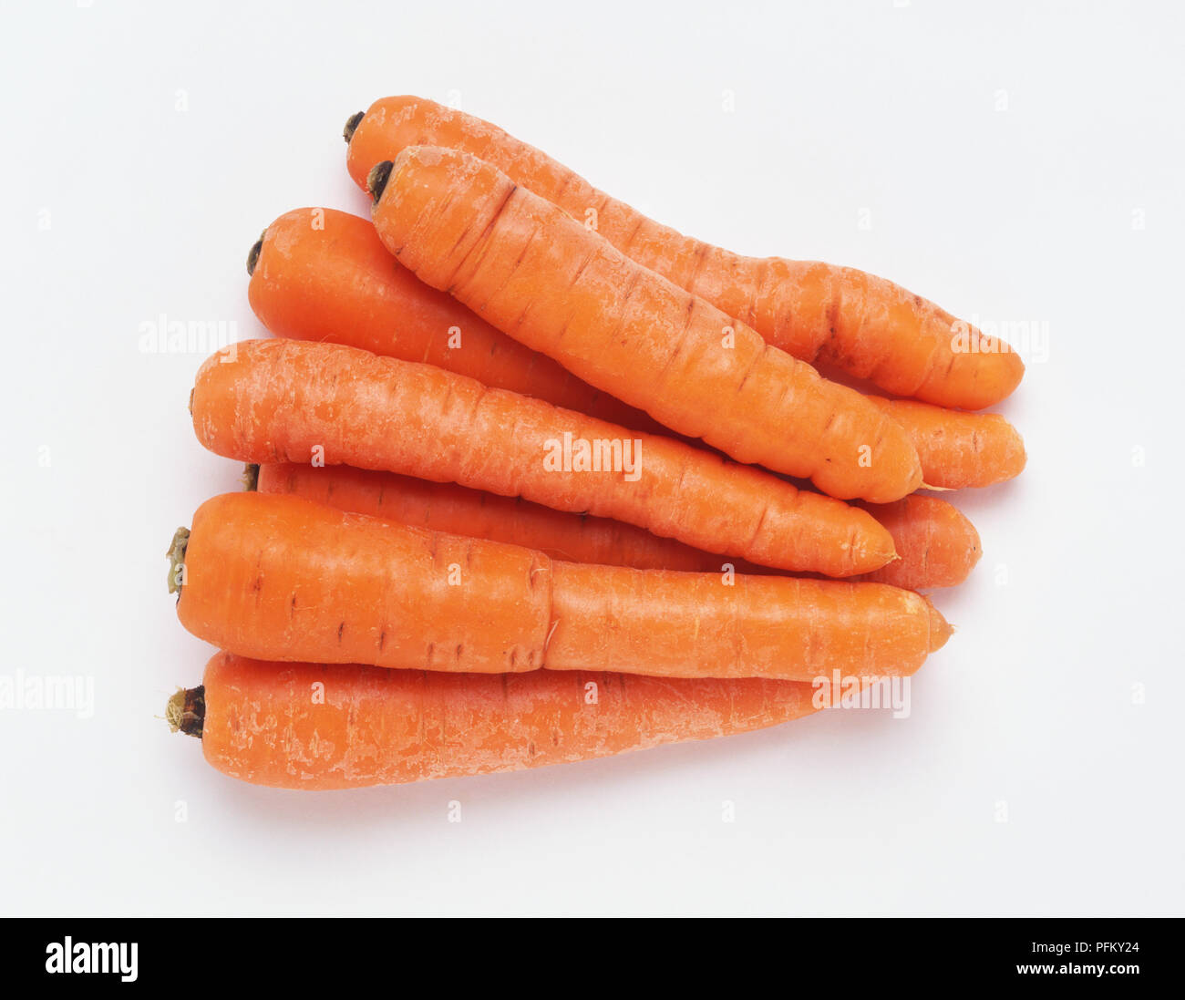 Seven stacked carrots, close up Stock Photo - Alamy