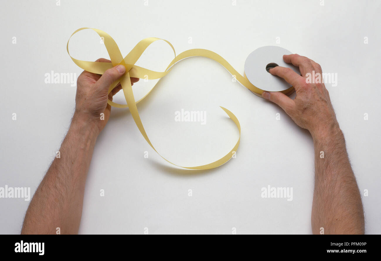 Hands unrolling hi-res stock photography and images - Alamy