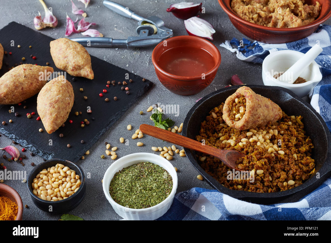cooking a kibbeh on a kitchen of ground beef meat mixed with bulgur ...