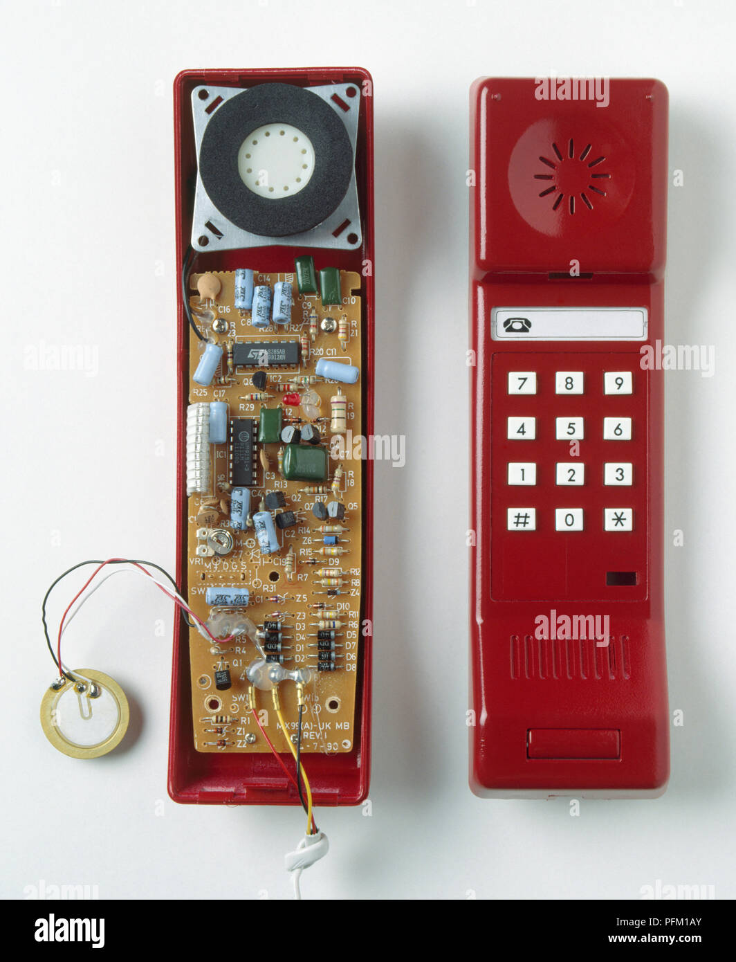 Old fashioned telephone receiver cover and interior showing circuit ...