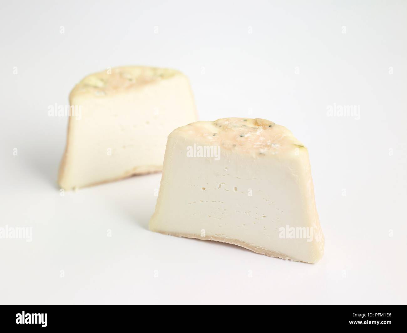 Sliced cone of French Maconnais AOC goat and cow's milk cheese Stock ...