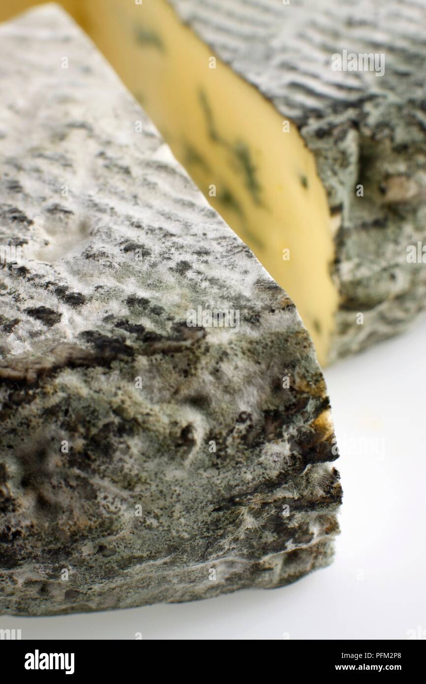 Cremeux de Puy, ash-coated cow's milk cheese with slice cut away, close ...