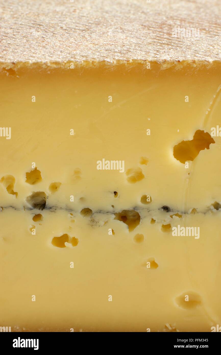 Morbier cow's milk cheese, showing characteristic layer of ash in the ...