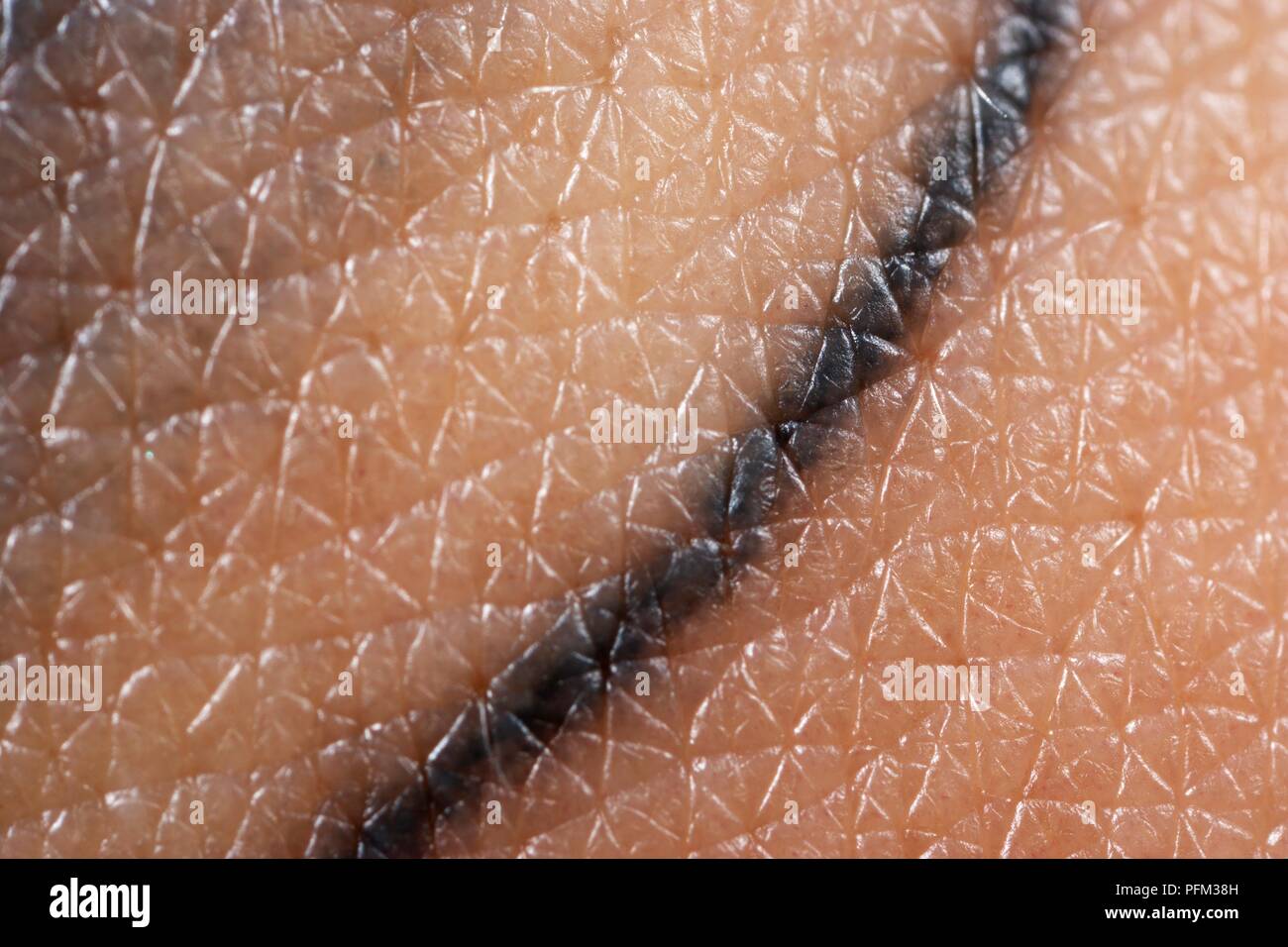 Black line tattoo on skin of young woman Stock Photo - Alamy