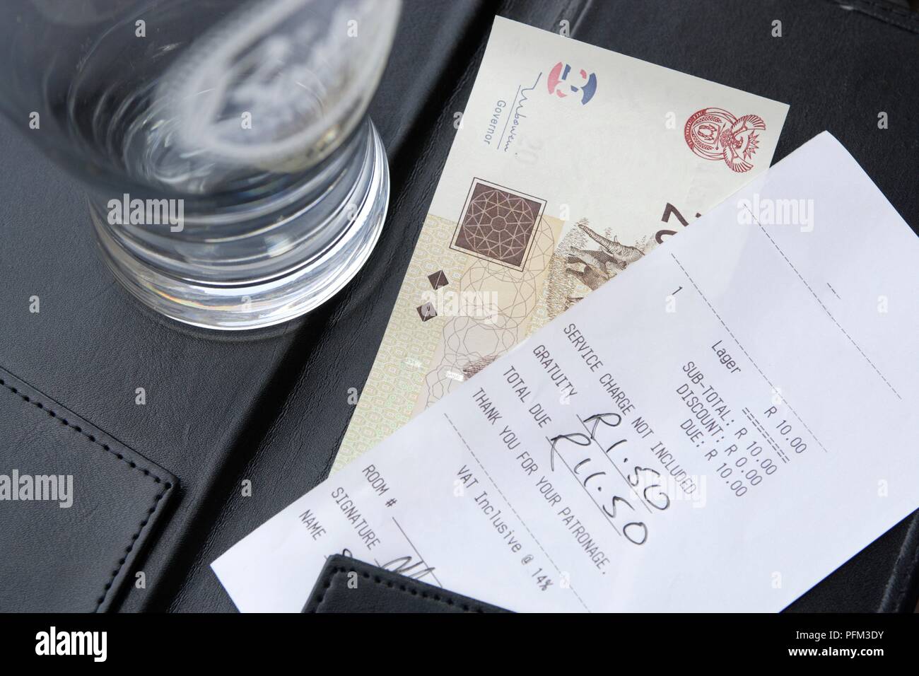 South Africa, receipt partly covering a banknote Stock Photo - Alamy