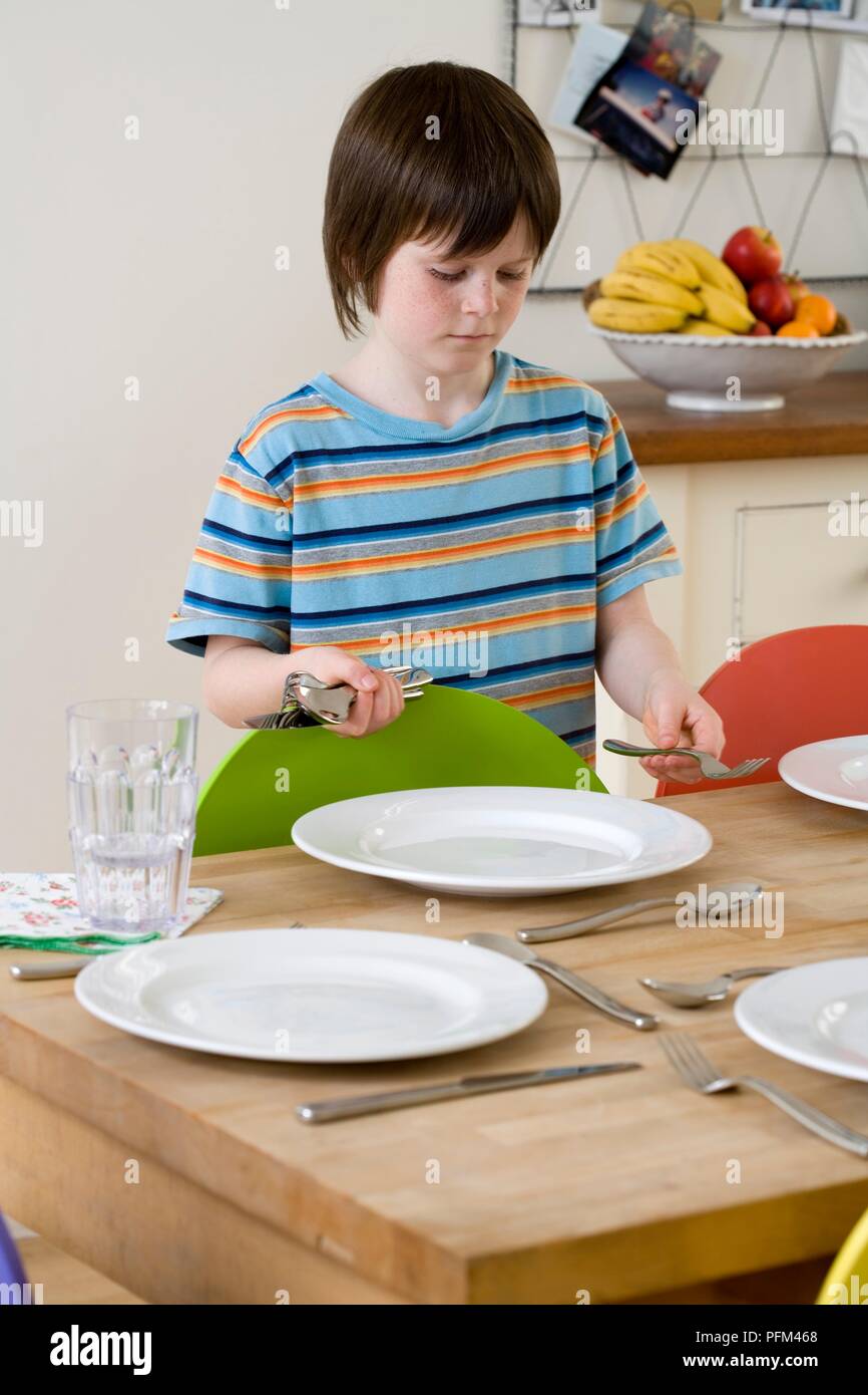 Boy chores dining table hi-res stock photography and images - Alamy