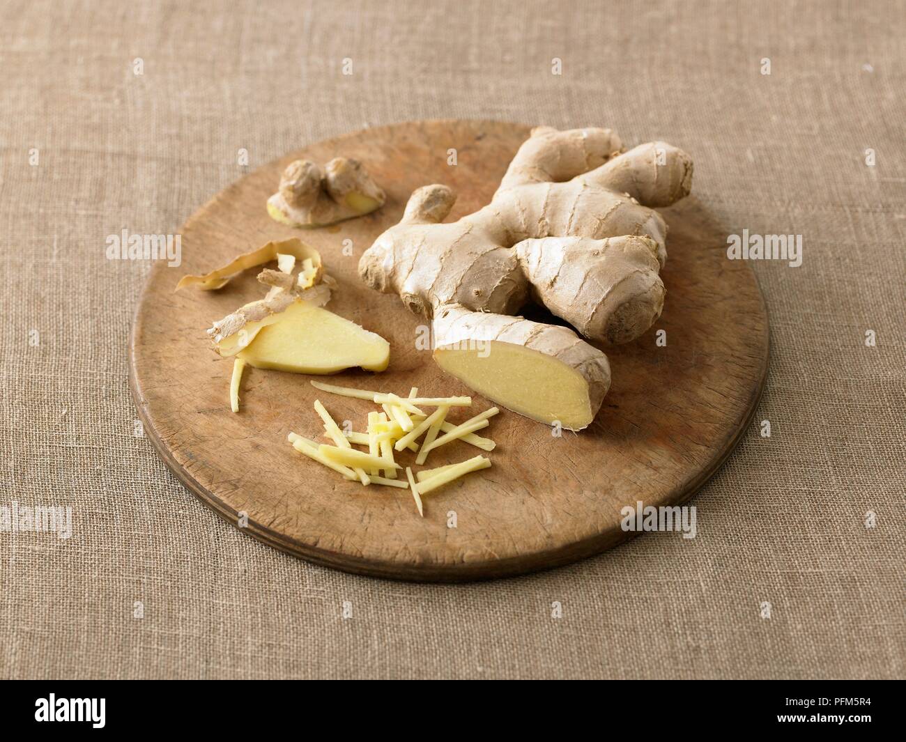 Ginger sliced and shredded on chopping board Stock Photo - Alamy