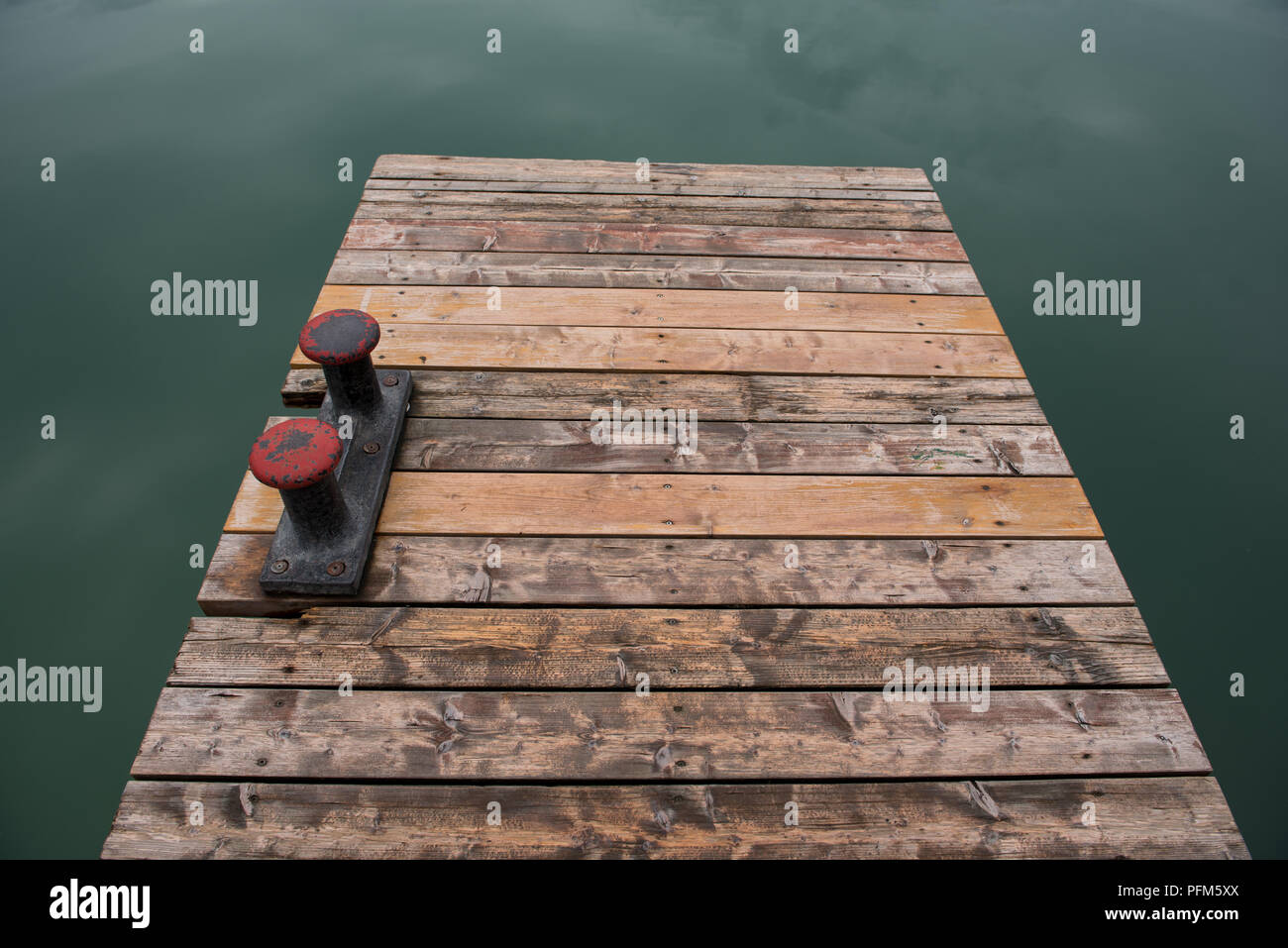 Old wooden dock in green water. Wooden pier Stock Photo - Alamy
