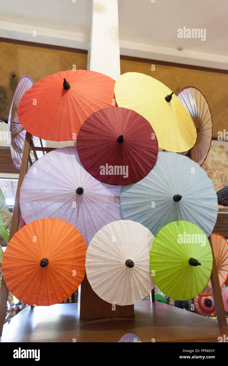 Many colored and handmade umbrellas for sale in a factory in Thailand ...