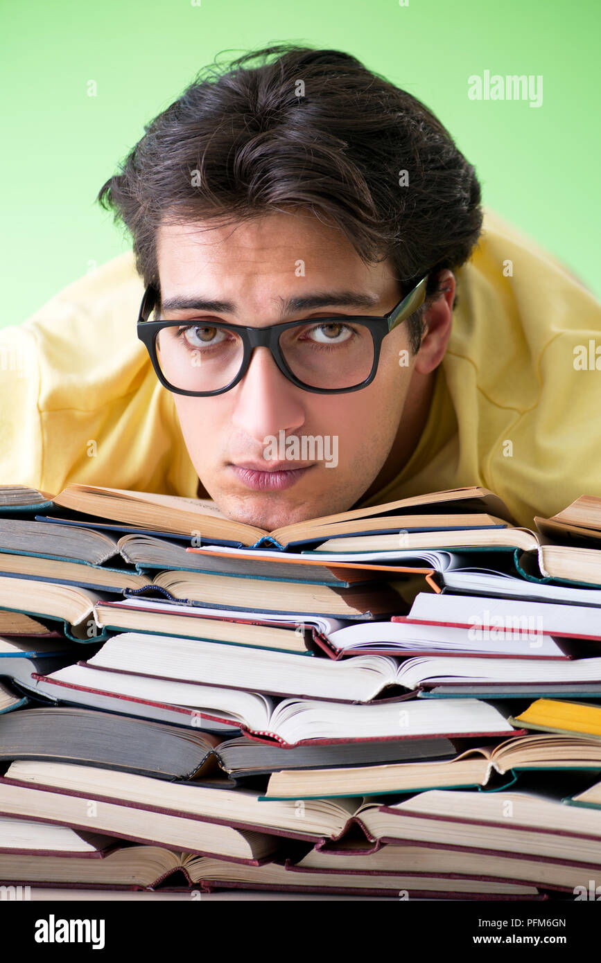 Student with too many books to read before exam Stock Photo - Alamy