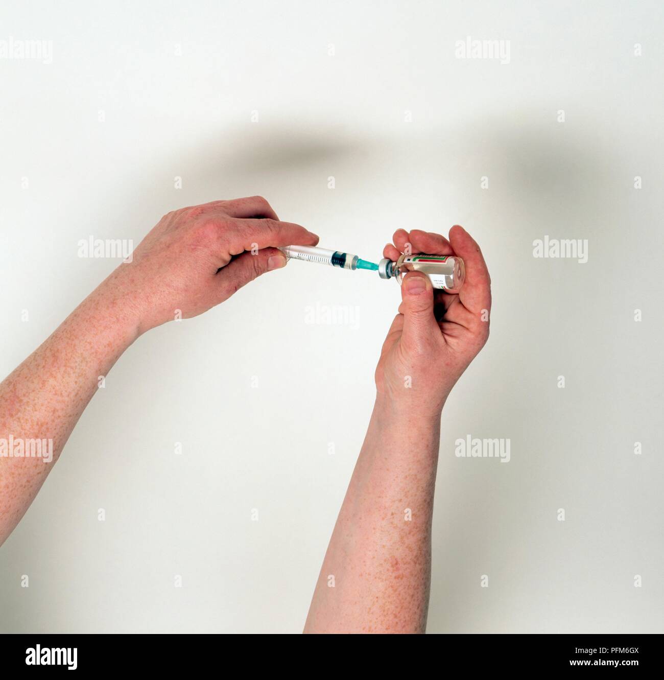 Preparing an injection, drawing medicine into syringe, close-up Stock ...