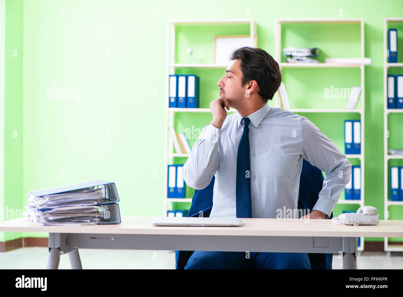 Employee doing exercises during break at work Stock Photo - Alamy