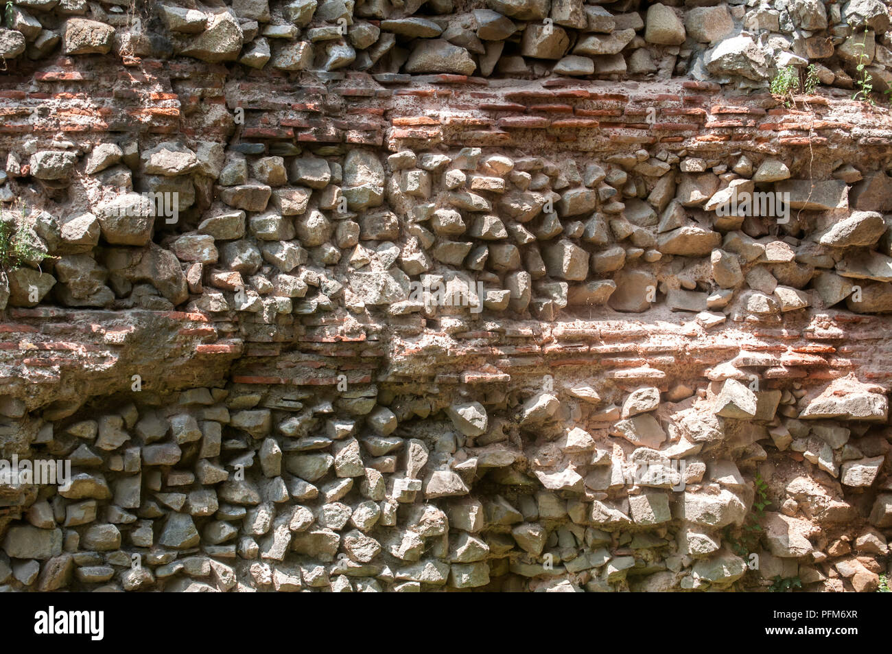 Ancient Roman stone and ceramic tiles wall closeup as background Stock ...