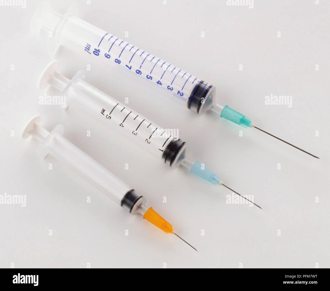 Three plastic syringes, close up Stock Photo - Alamy